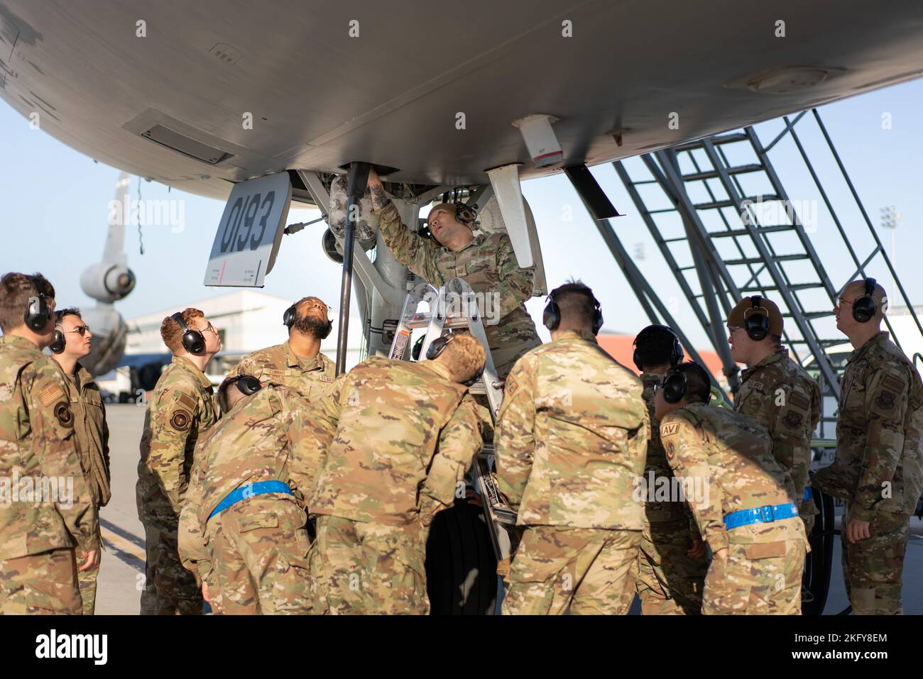U.S. Air Force Staff Sgt. Mark Hedge, center, 60th Maintenance ...