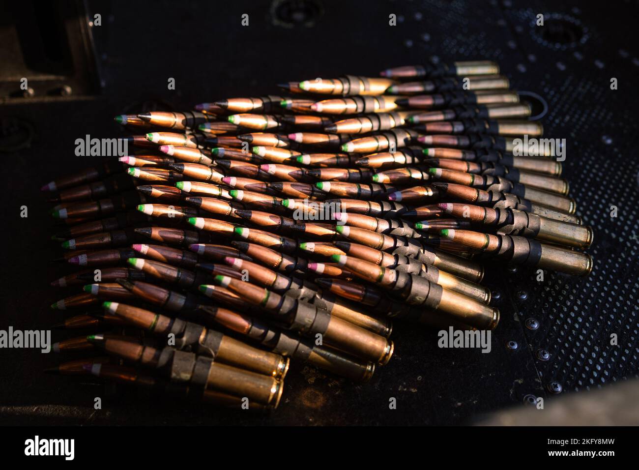 Linked ammunition for a GAU-21 .50 caliber machine gun are staged ...