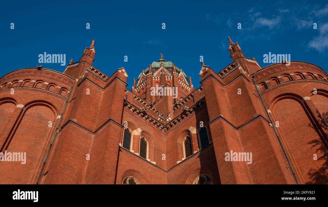 An exterior of St Peter's Cathedral under the blue sky in Dakovo Stock ...