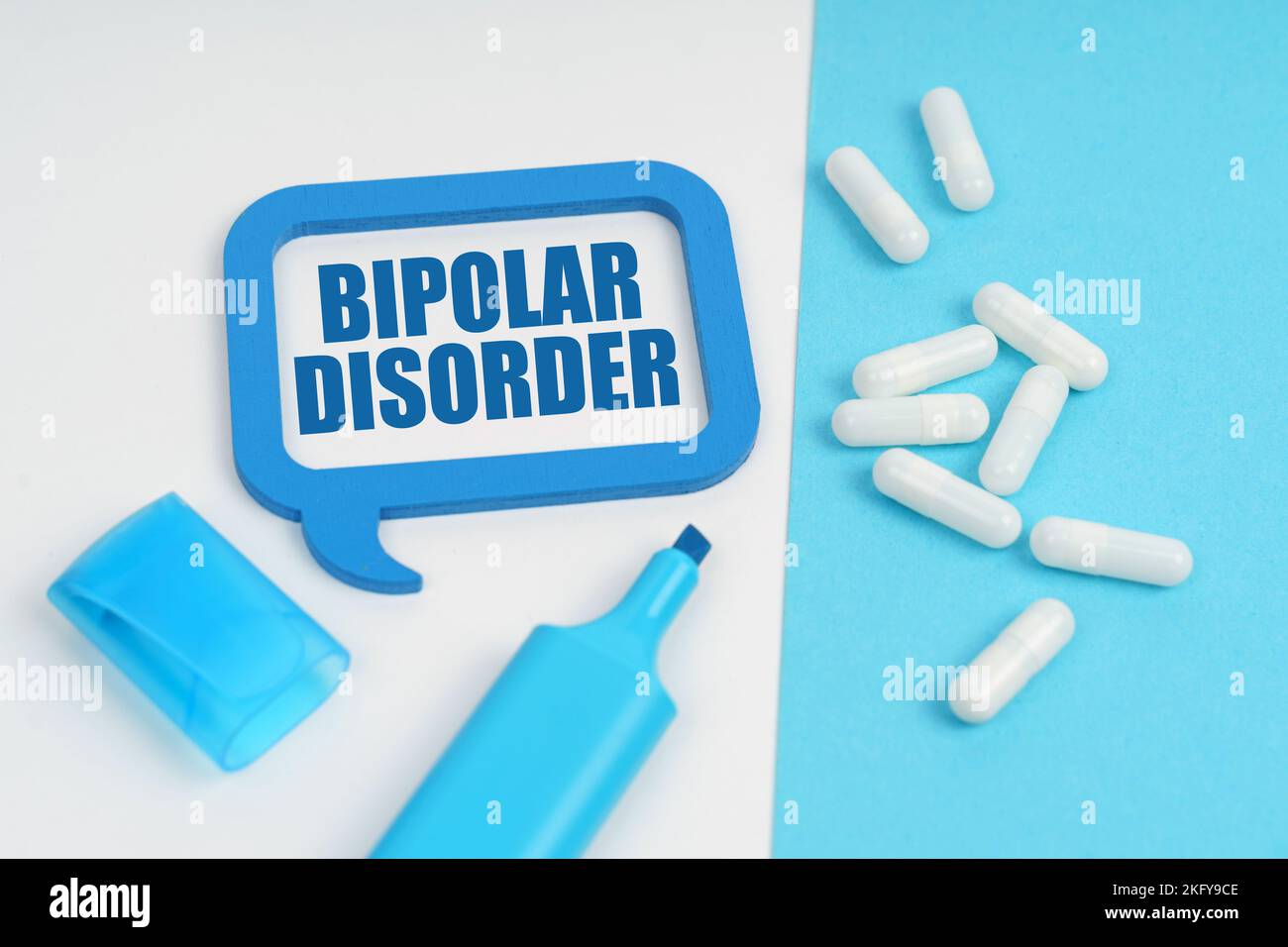 Medical concept. On the white and blue surface are a marker, tablets ...