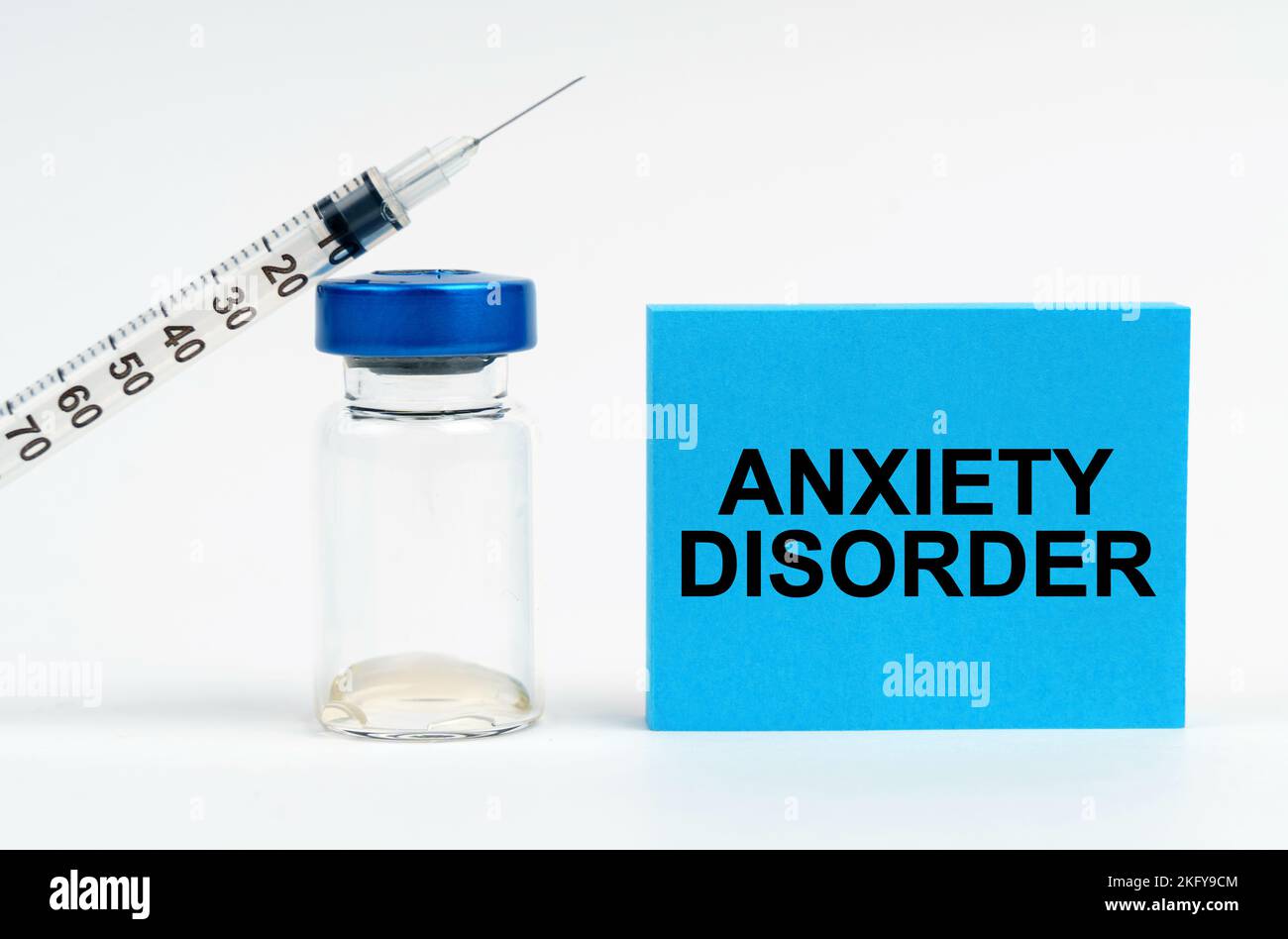 Medicine concept. On the table is a syringe, an injection and a blue ...