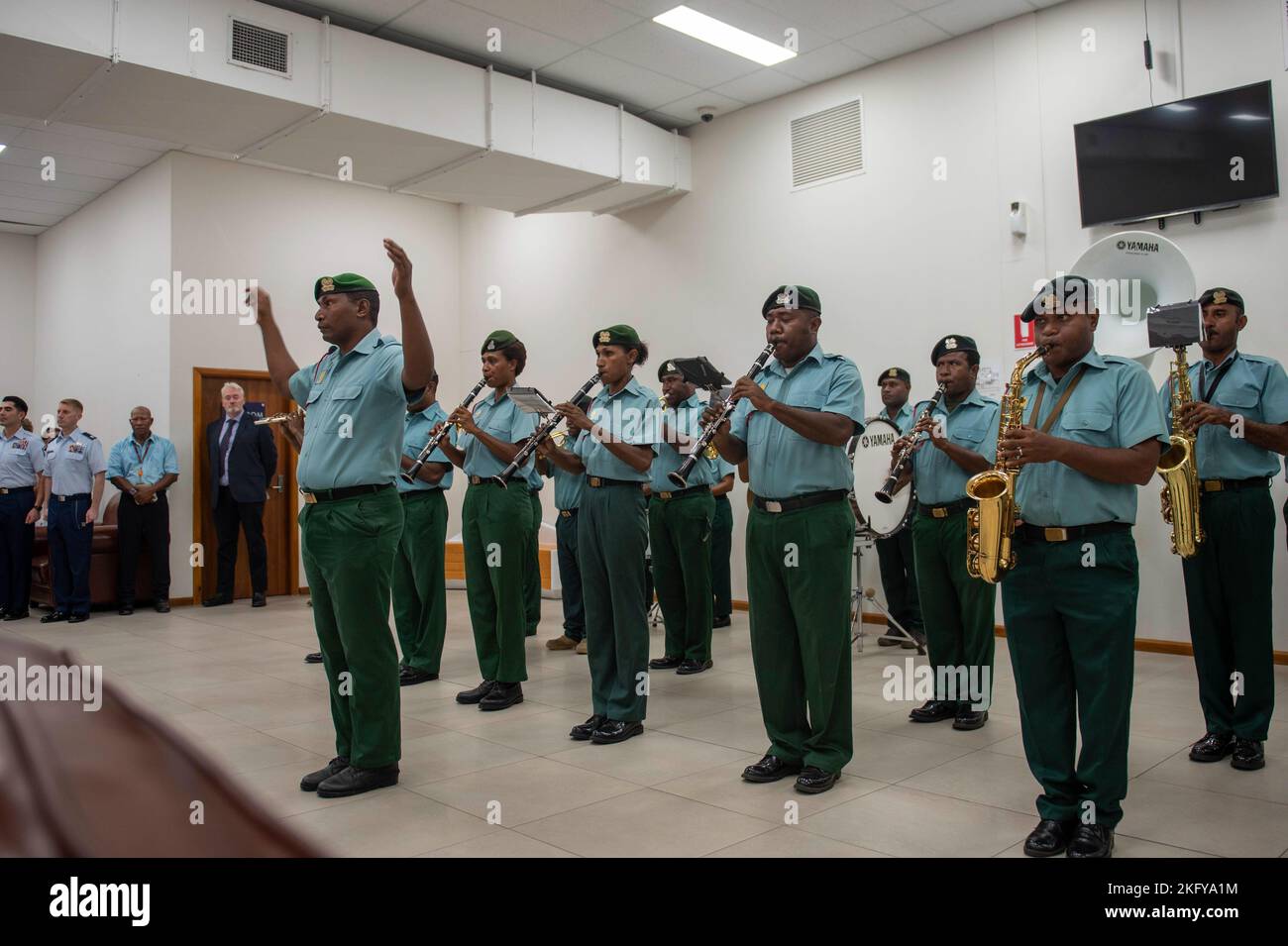 Members of the Papua New Guinea Defense Force band play for attendees ...