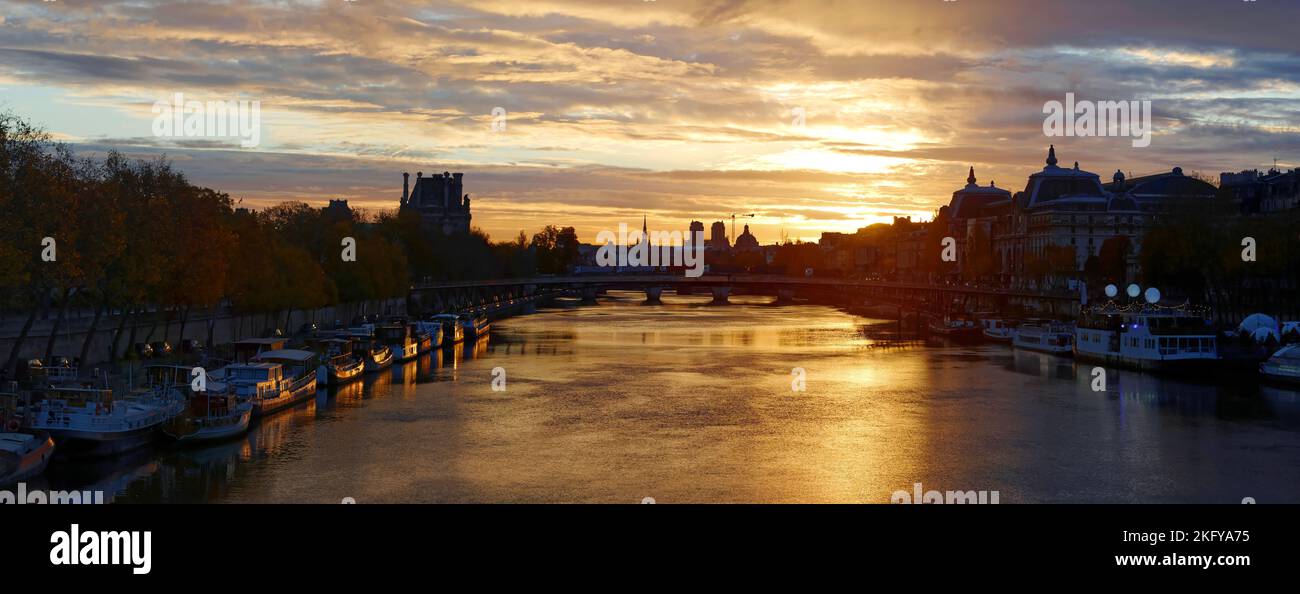 Seine river and Old Town of Paris , France in the beautiful sunrise. A ...