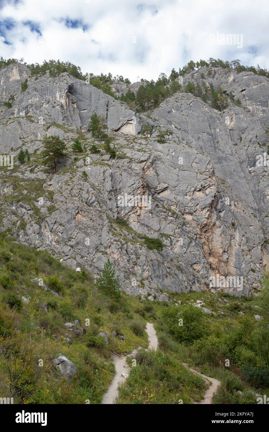 A large mountain with a sheer cliff close-up against the sky Stock ...