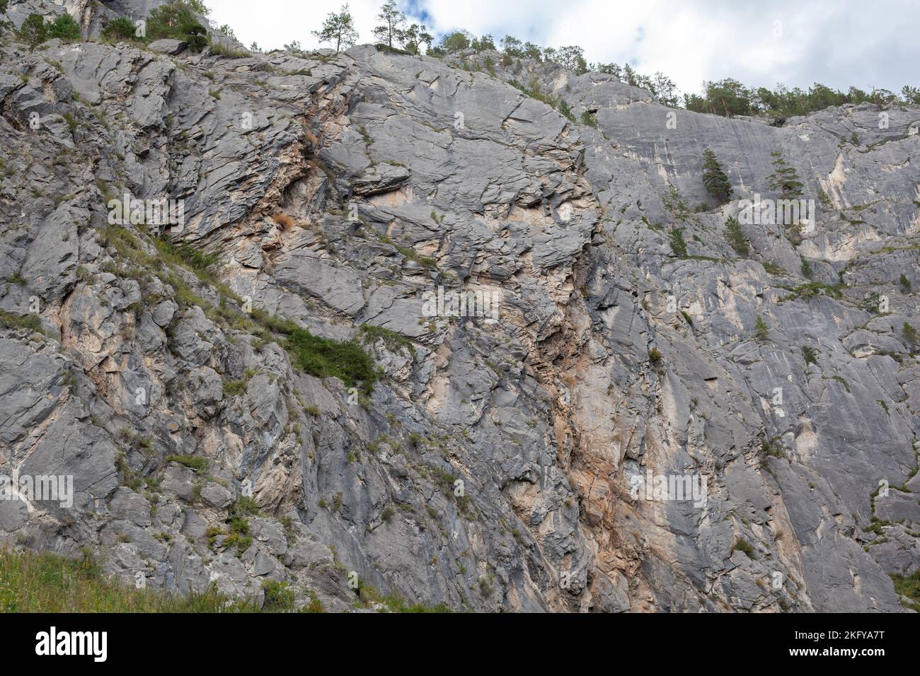 A large mountain with a sheer cliff close-up against the sky Stock ...