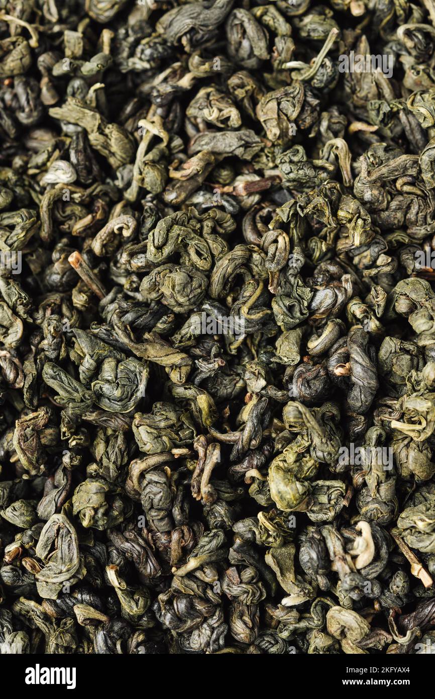 Dry green tea leaves. close-up, background texture Stock Photo - Alamy