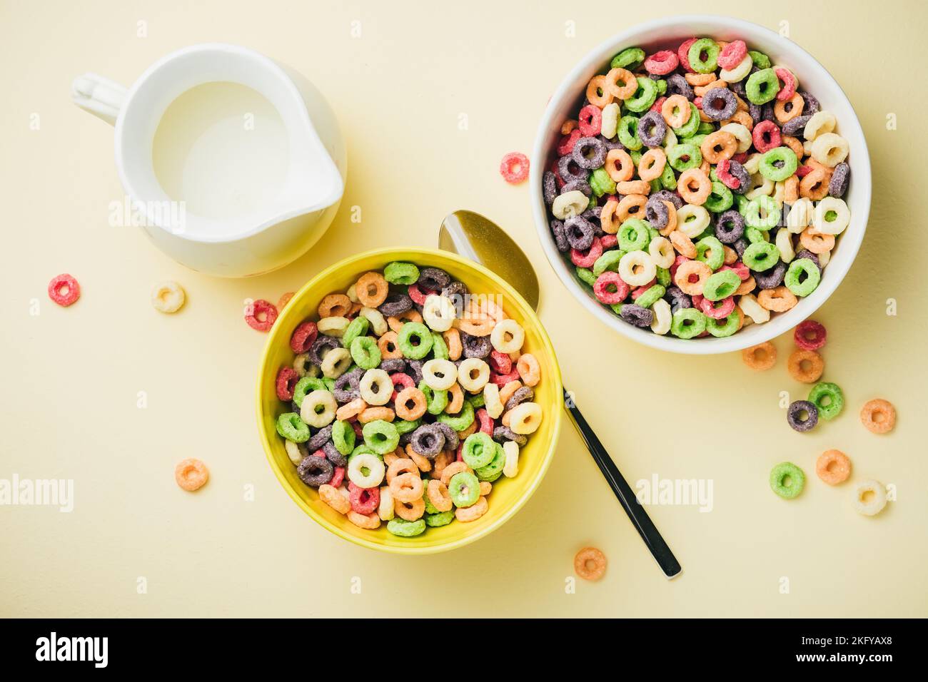 Colorful corn rings in bowl on yellow background. Ring-shaped sweet ...