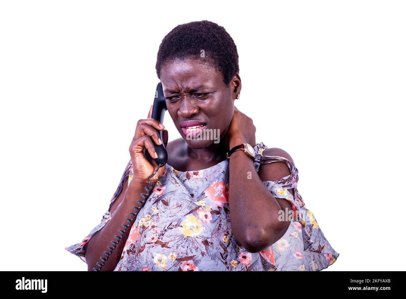 portrait of a beautiful young woman with tight face talking on mobile ...