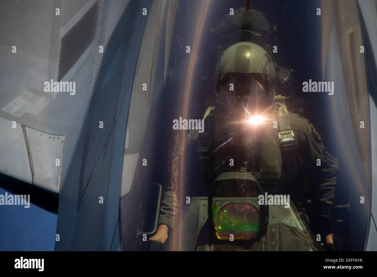 A U.S. Air Force F-22 Fighter pilot maneuvers their jet under a KC-135 ...