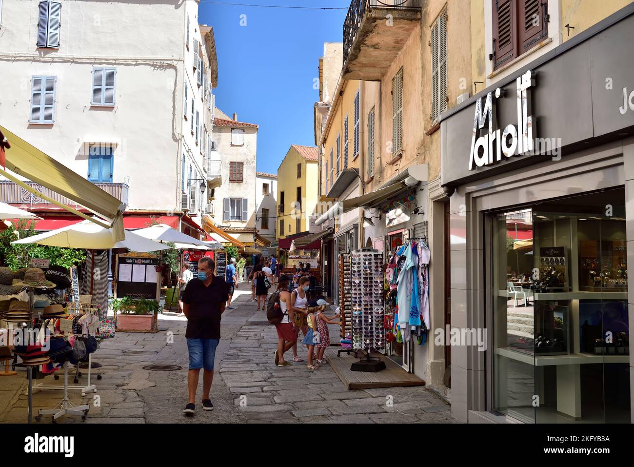 CALVI, CORSICA, FRANCE; August 21, 2020: Tourists walking in center of ...