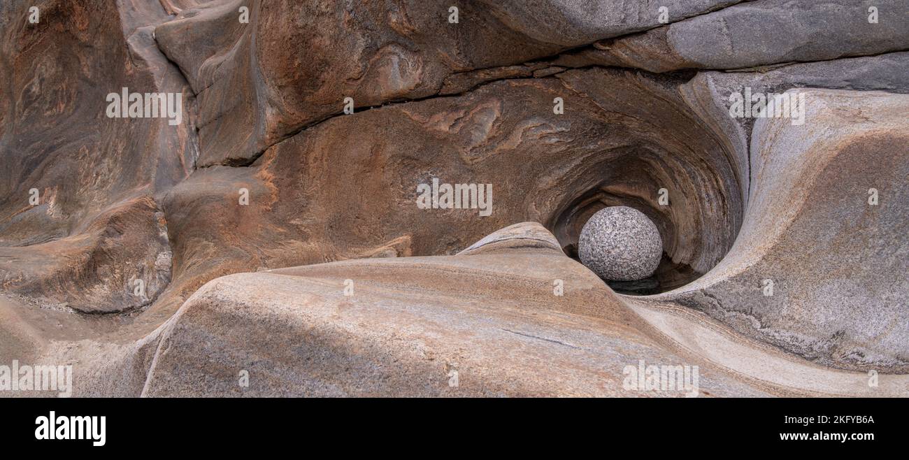 A round stone in glacier mill with beautiful stone formation near ...