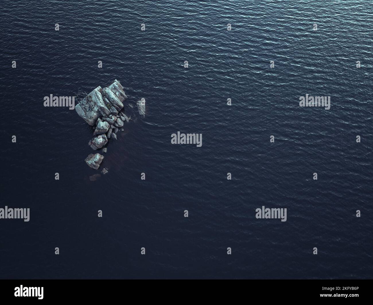 An aerial of rugged stones in the middle of a blue seascape Stock Photo ...
