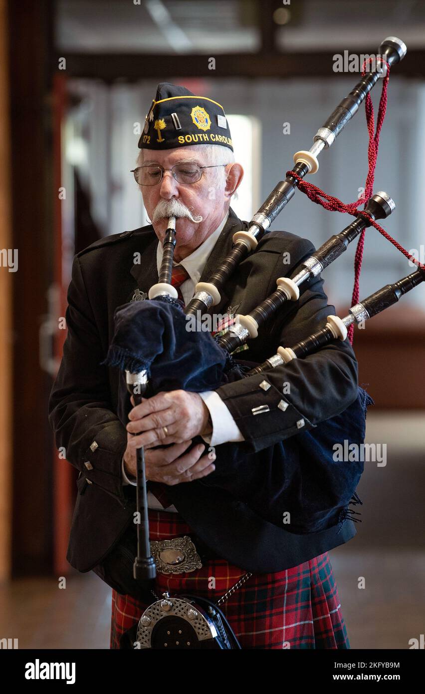 A bagpiper plays a dirge during a memorial service for the late Staff ...