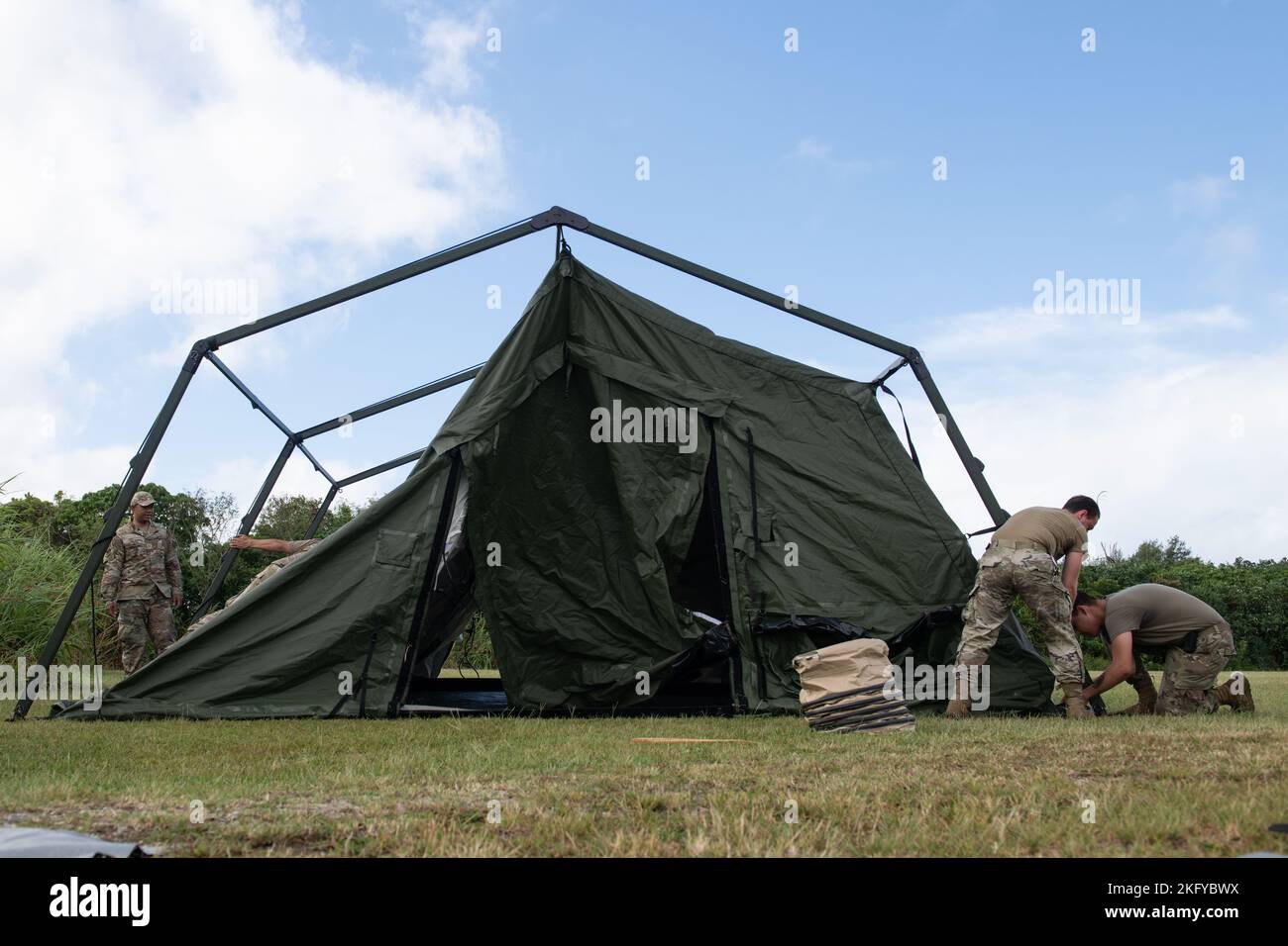 U.S. Air Force Airmen assigned to the 18th Wing set up a tent during an ...