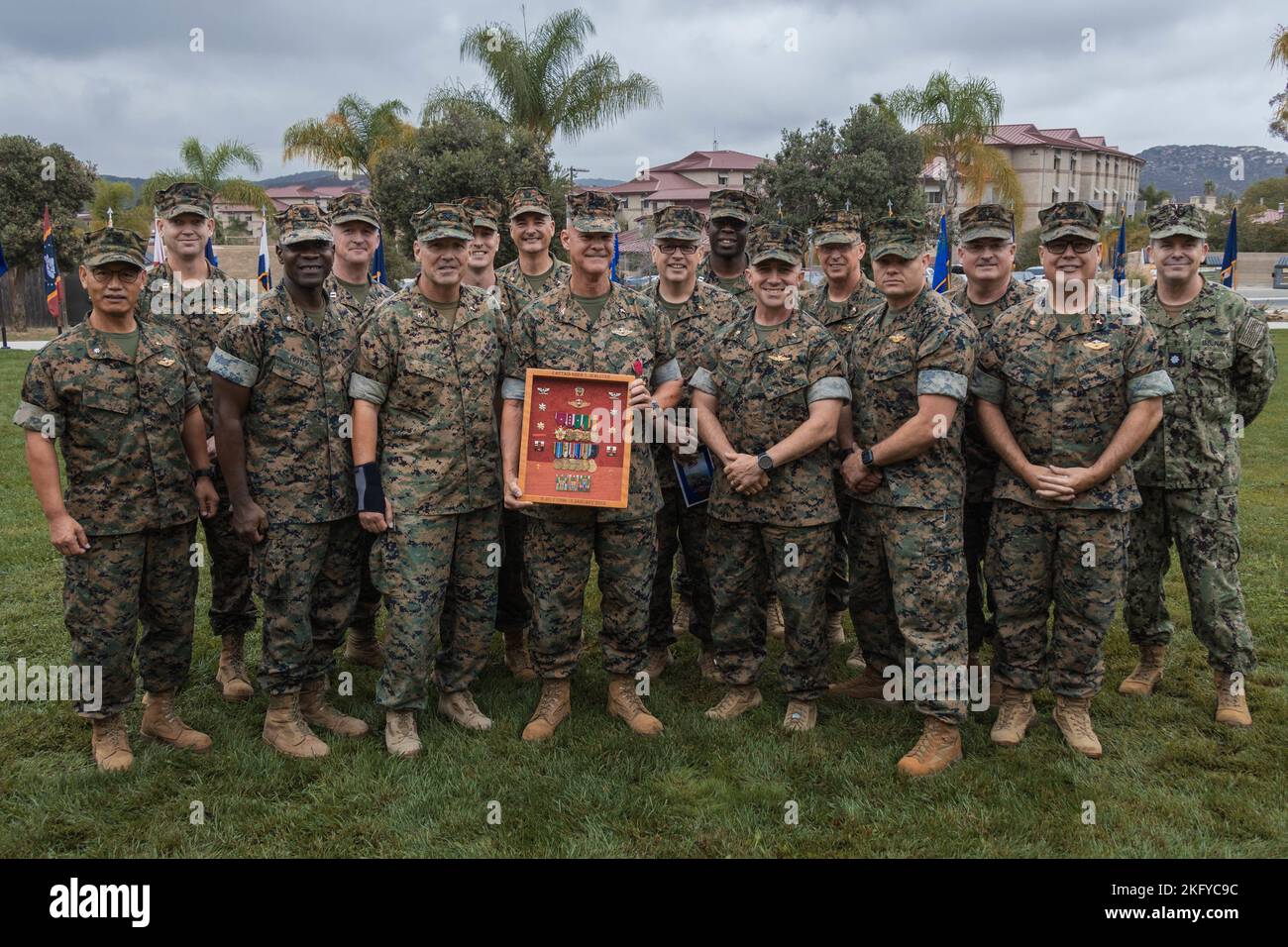 U.S. Navy chaplains pose for a group photo during Capt. Schluter’s retirement ceremony on Camp ...