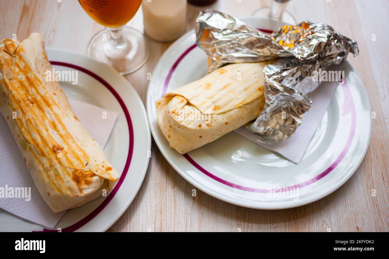 Turkish wrapped dish durum on white plate Stock Photo - Alamy