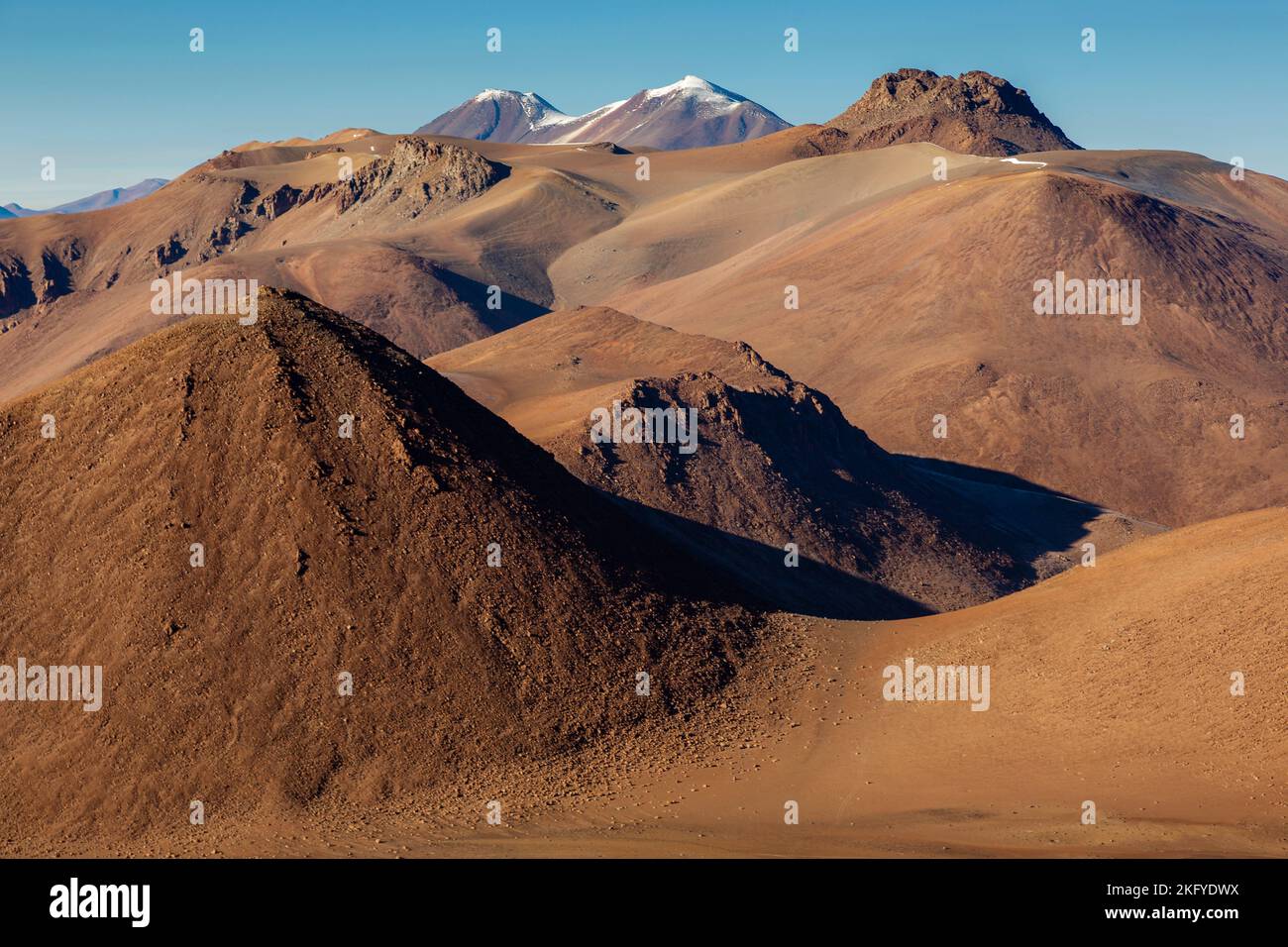 Atacama desert, snowcapped volcanoes and arid landscape in Northern ...