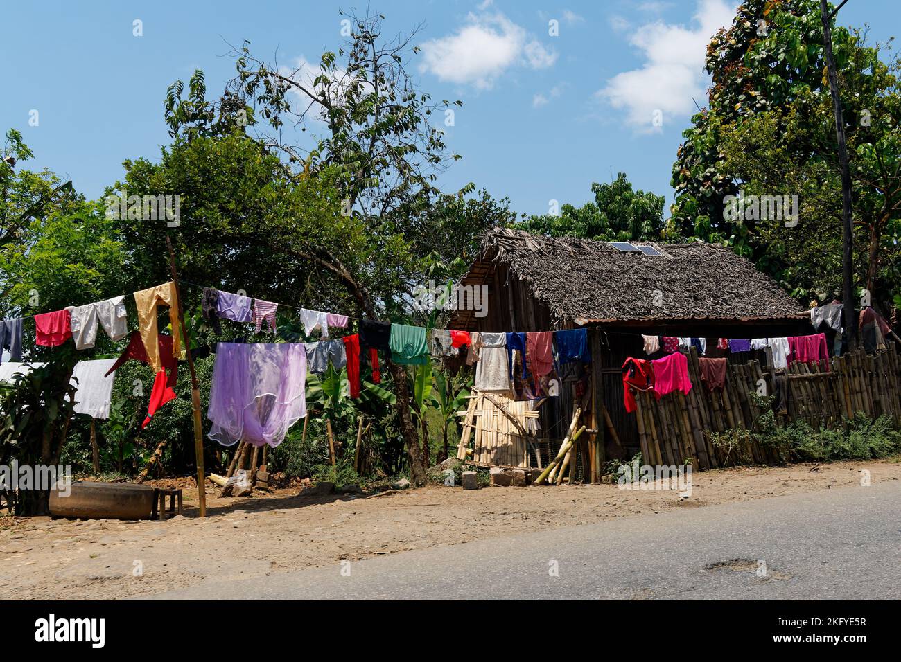 Drying of the washed colorful clothes on the hot african sun, typical ...
