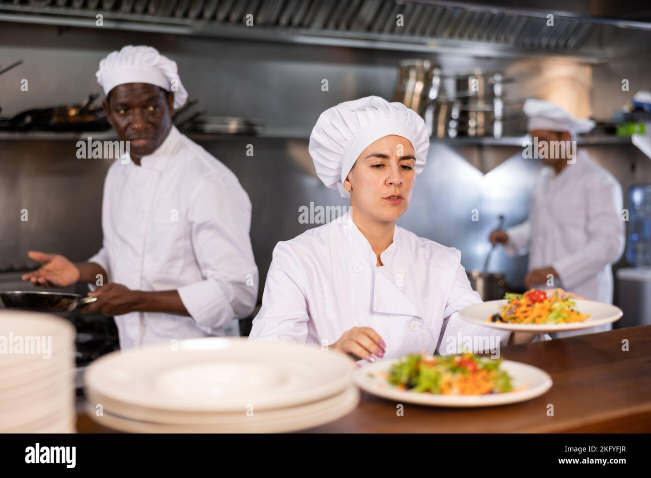 Portrait of woman chef giving out meal Stock Photo - Alamy