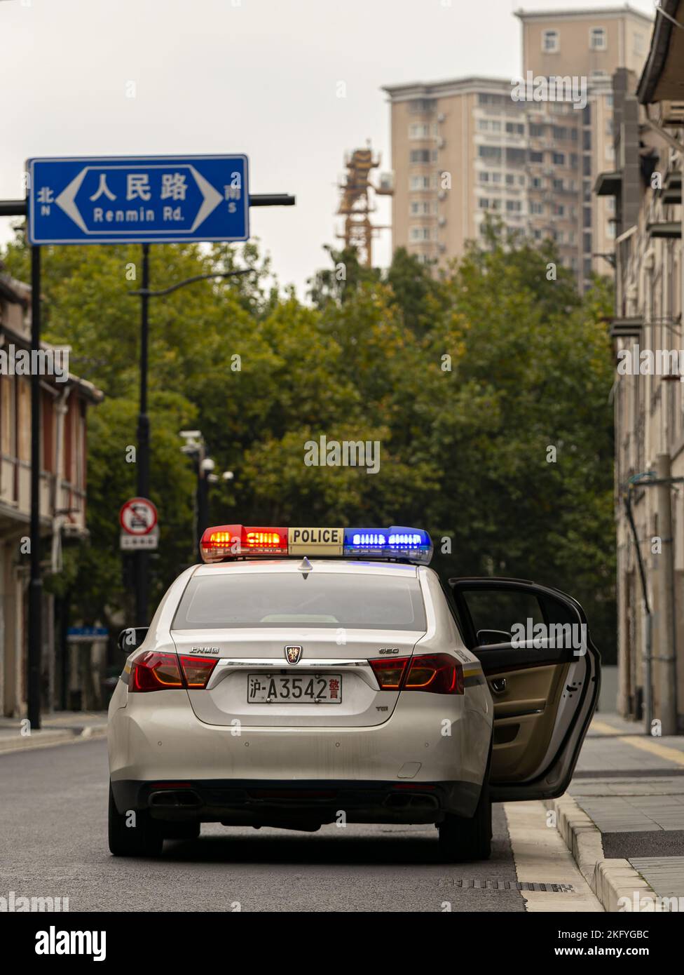 A vertical shot of police cars parked on Renmin Road to serve the ...