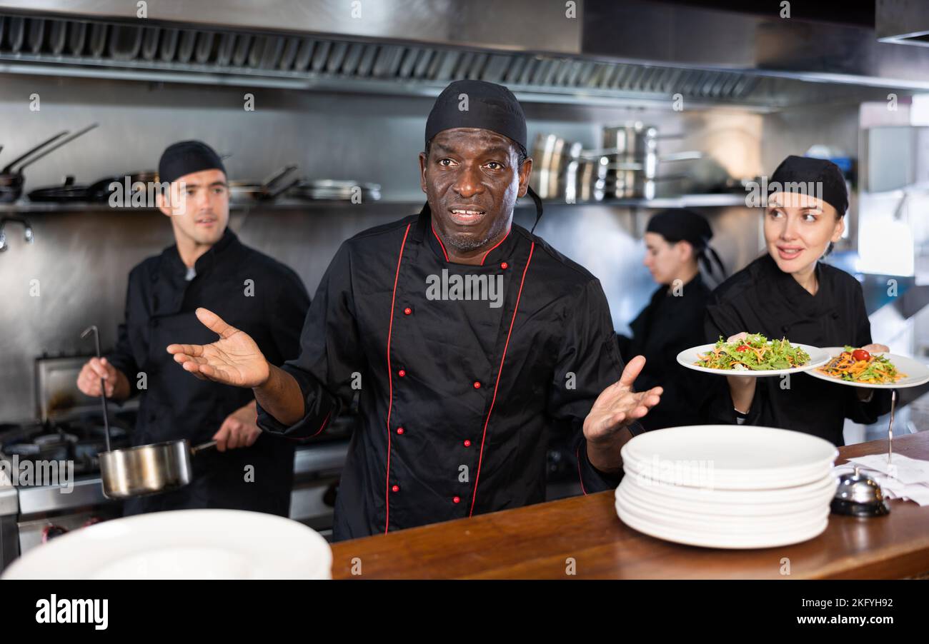 Standing communication gesturing uniform hi-res stock photography and ...