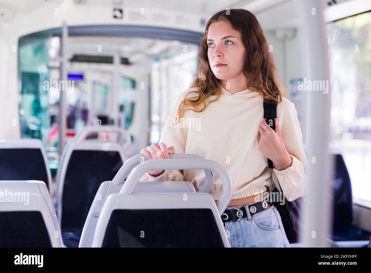 Portrait of a focused girl riding on public transport Stock Photo - Alamy