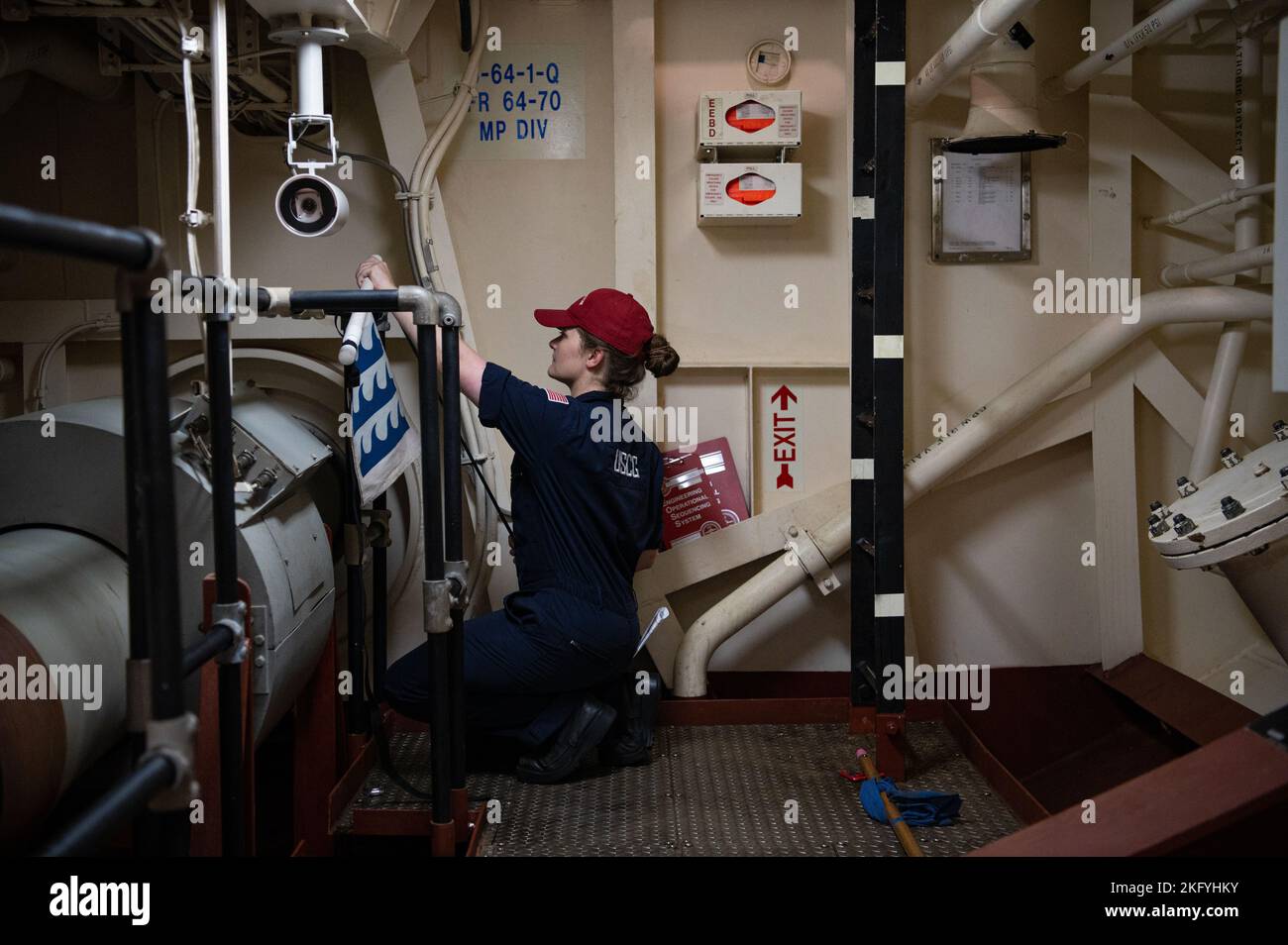 U.S. Coast Guard Petty Officer 2nd Class Taylor York, a damage ...