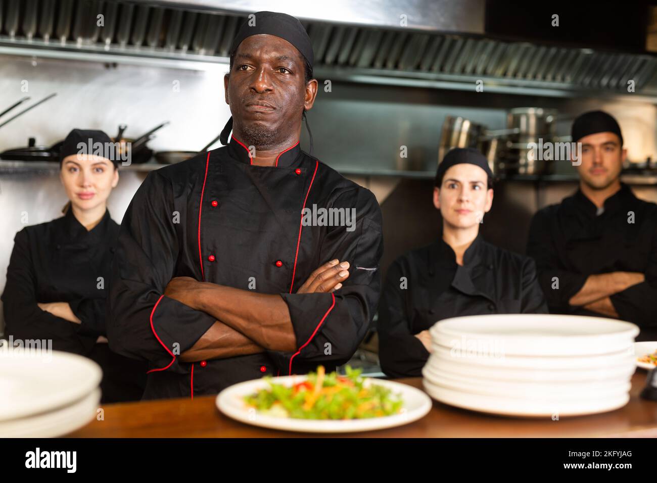 Team of chefs with man head chef Stock Photo - Alamy