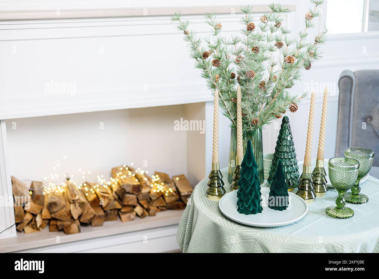 Table setting for Christmas or New Year's dinner with candles ...