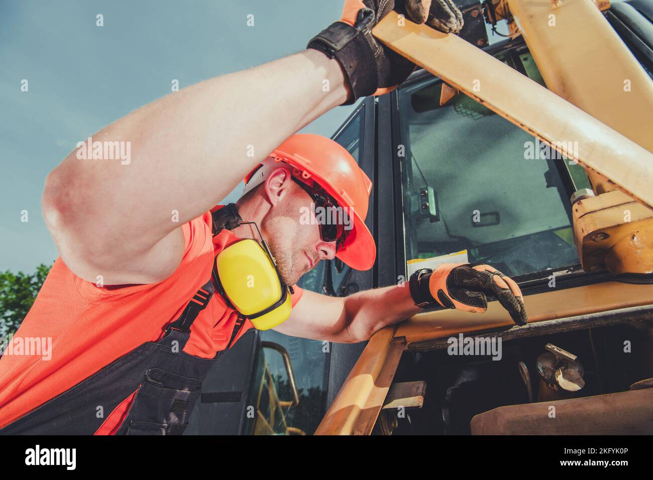 Professional Excavator Operator Checking the Condition of Machine's ...