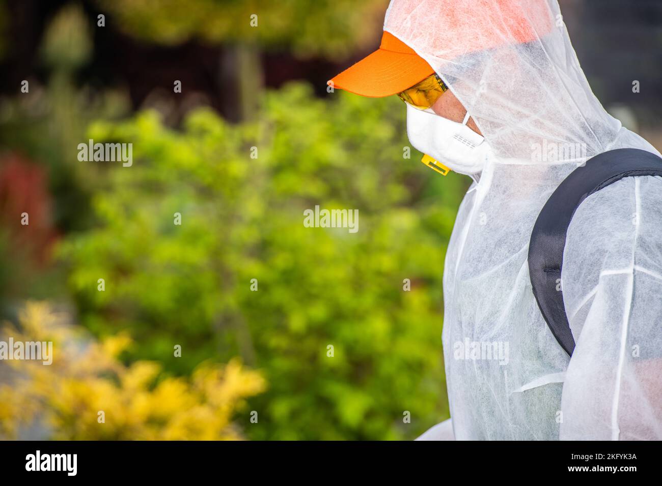 Professional Gardener in Protective Uniform Performing Pest-Control ...