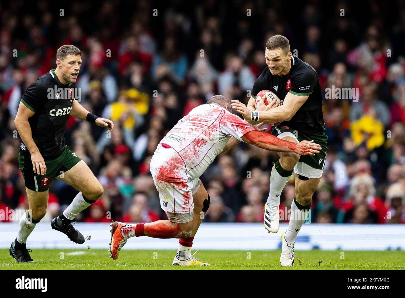 George North of Wales is tackled by Giorgi Chkoidze of Georgia during ...
