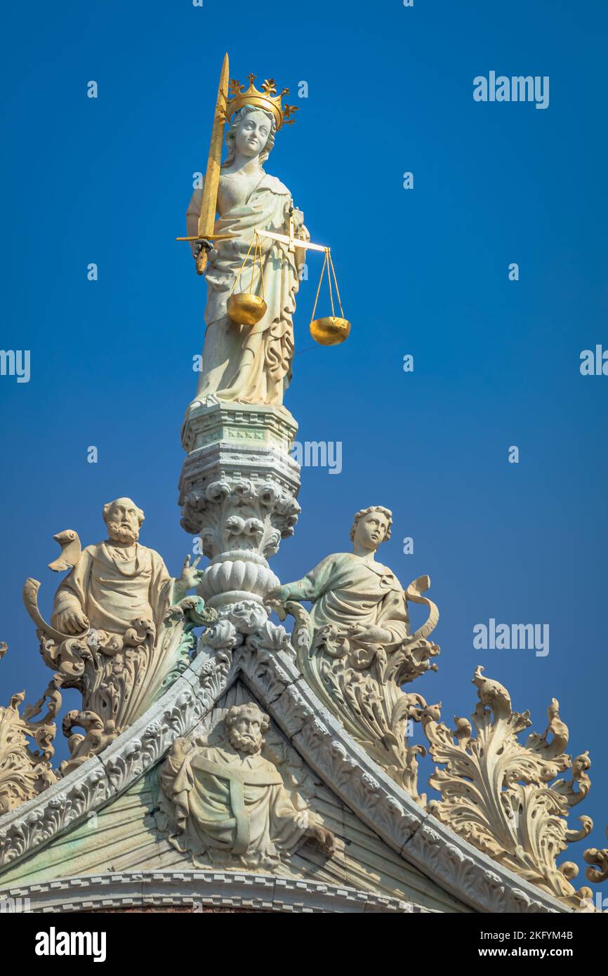 St Mark Basilica, lady justice and catholic statues, facade detail ...