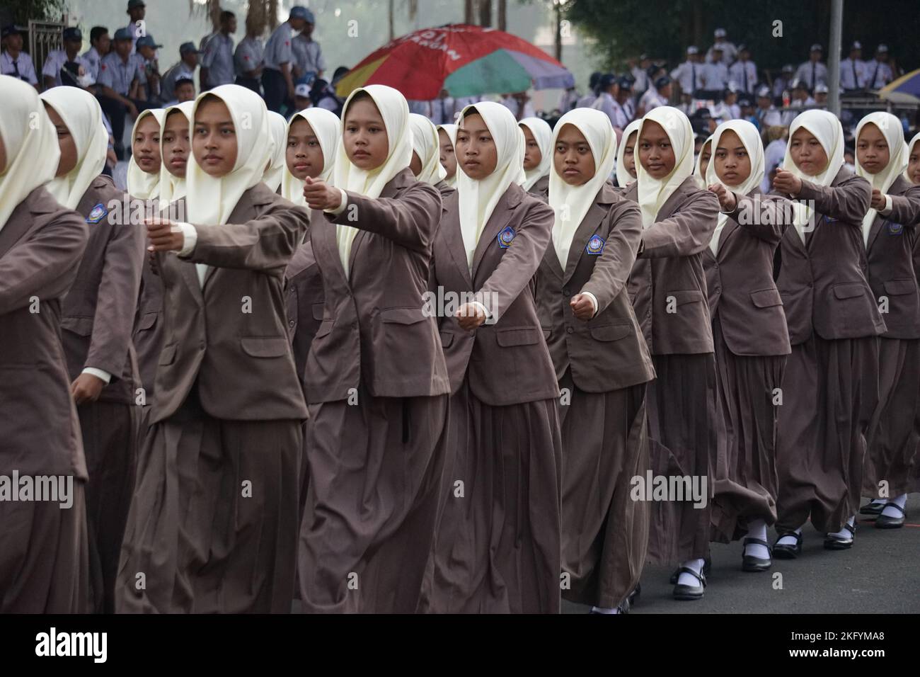 Indonesian senior high school students with uniforms, marching to ...