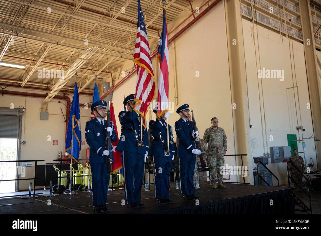 U.S. Airmen with the 156th Wing Honor Guard, present the colors during ...