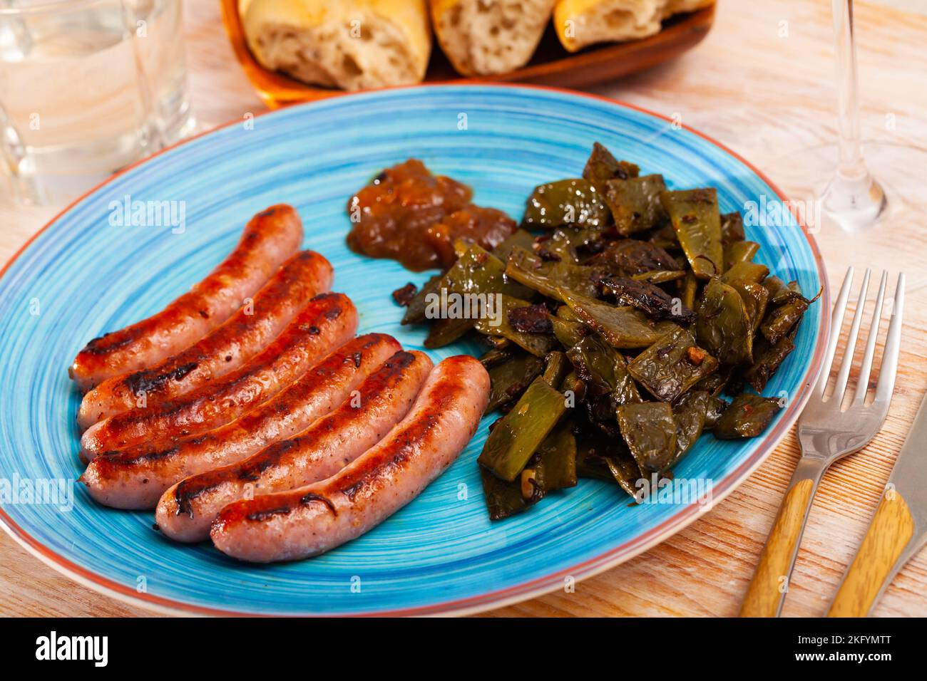 Roasted sausages with helda beans Stock Photo - Alamy