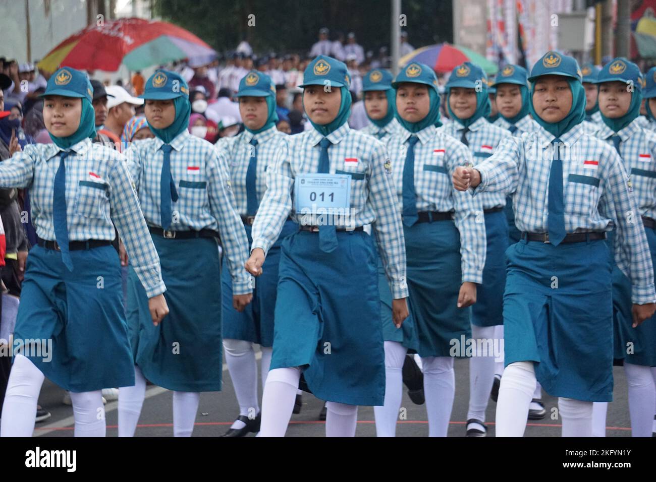 Indonesian senior high school students with uniforms, marching to ...