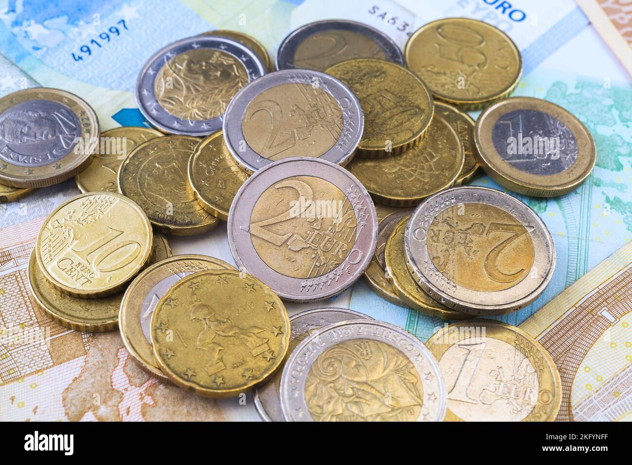 Various Euro coins on top of Euro bank notes Stock Photo - Alamy