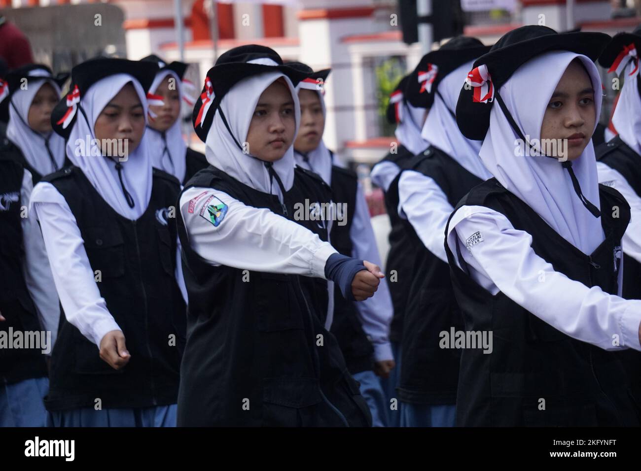 Indonesian senior high school students with uniforms, marching to ...