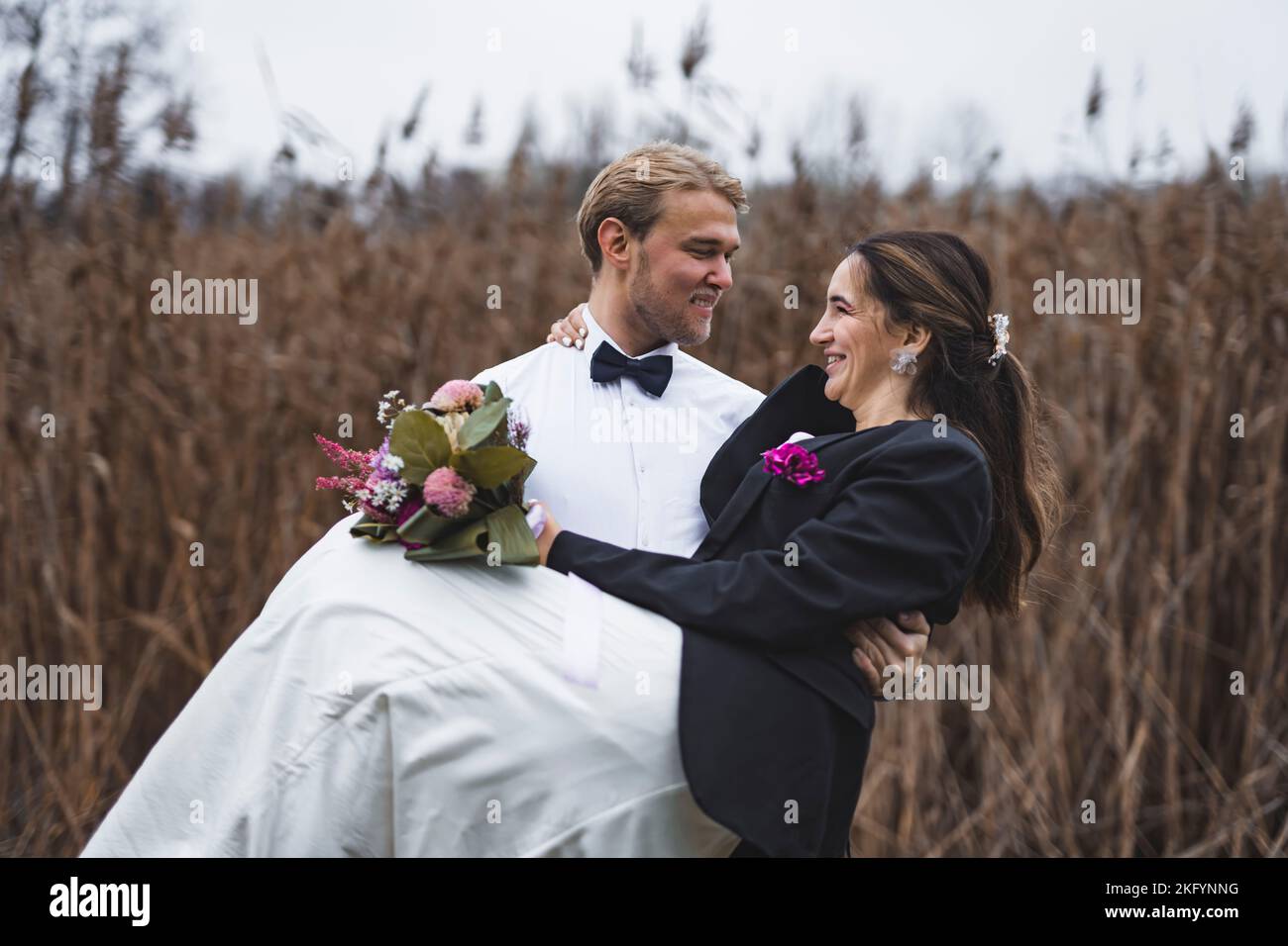 Traditional marital lift of the bride. Middle-Eastern long-haired bride ...