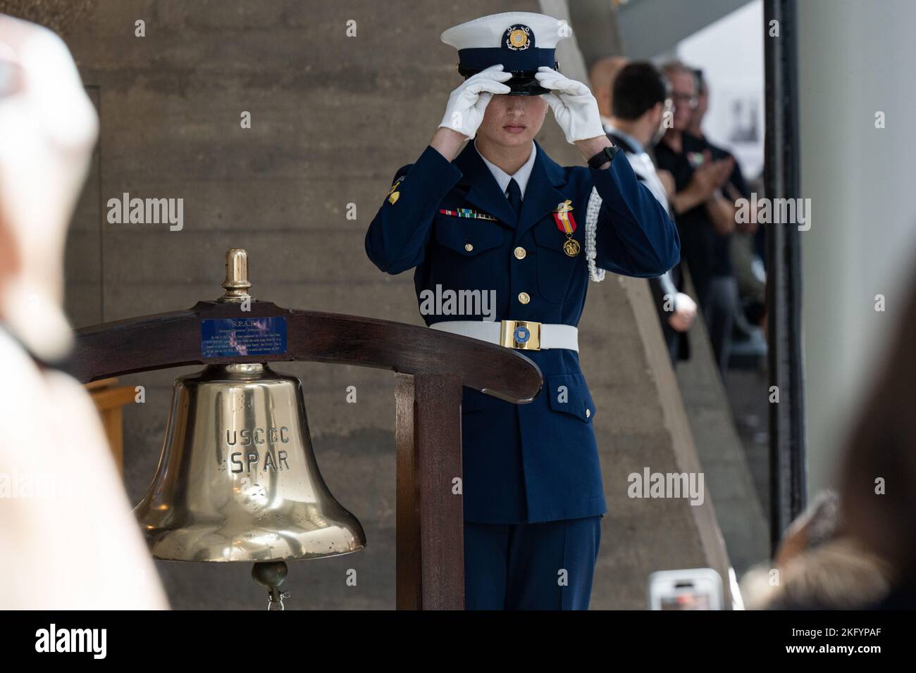 Coast Guard Seaman Allyson J. Smith rings the celebratory bell during ...