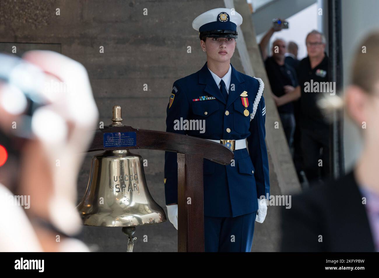 Coast Guard Seaman Allyson J. Smith rings the celebratory bell during ...