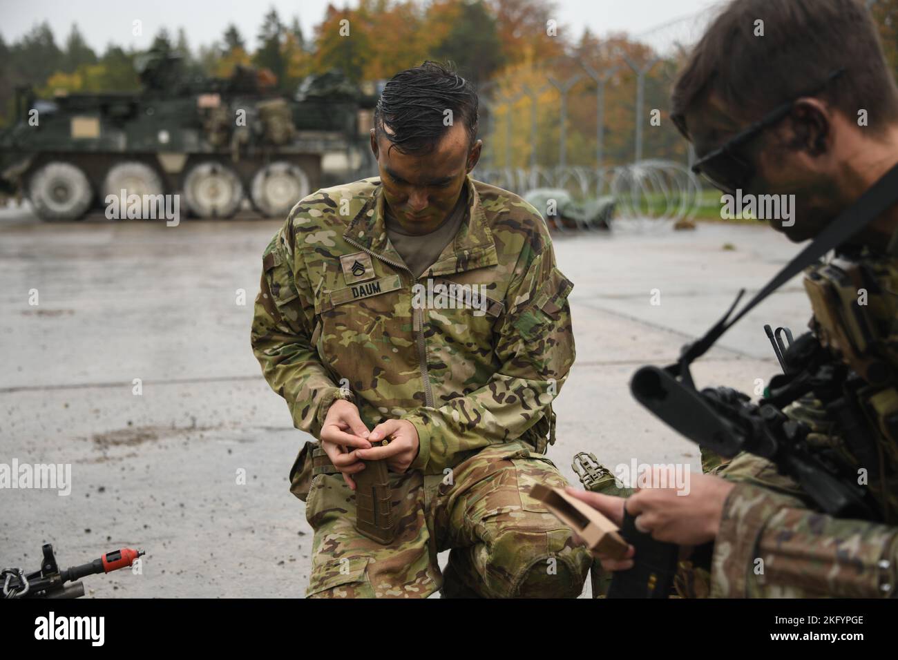 U.S. Soldiers assigned to 1st Squadron, 2nd Cavalry Regiment load blank ...