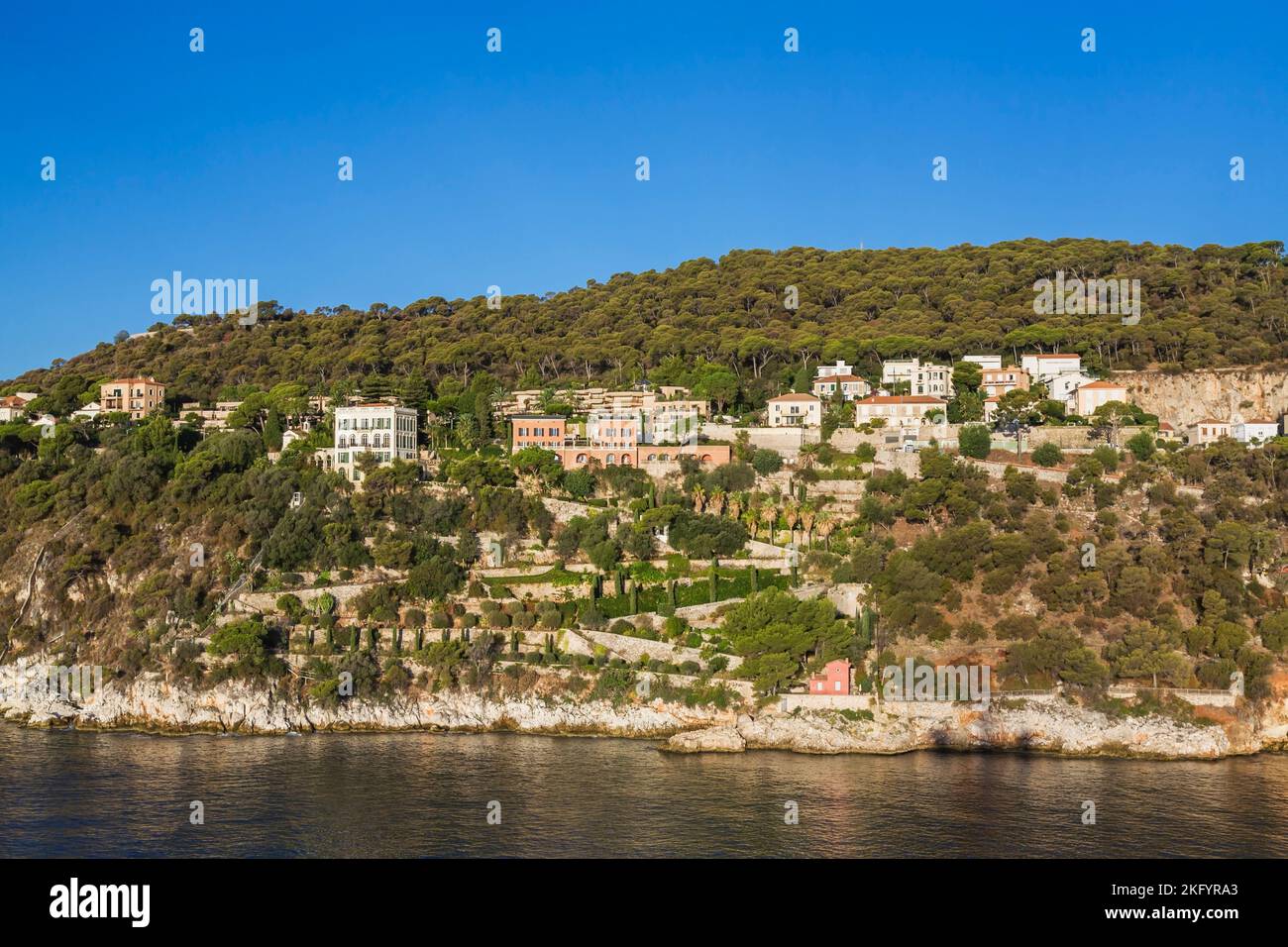 Landscaped hillside with residential apartment and commercial buildings ...