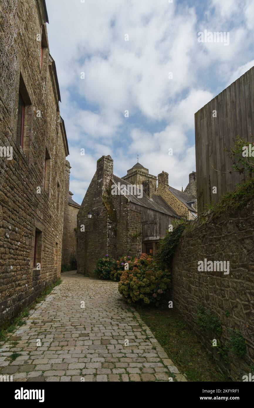 Medieval street with cobbles in the small beautiful village of Locronan ...