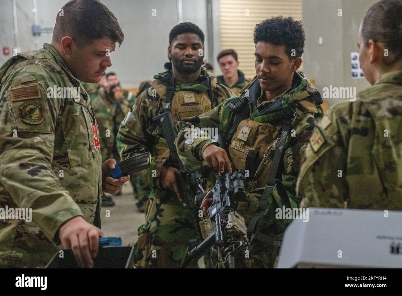 A 374th Security Forces Squadron Airmen ensures the barrel of his M4 ...
