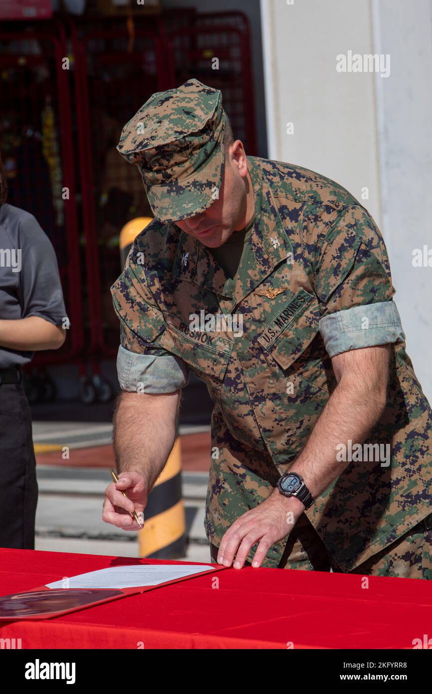 U.S. Marine Corps Col. Richard Rusnok, left, the commanding officer of Marine Corps Air Station ...
