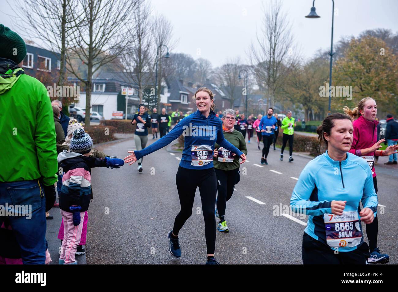 Child running across road hi-res stock photography and images - Alamy