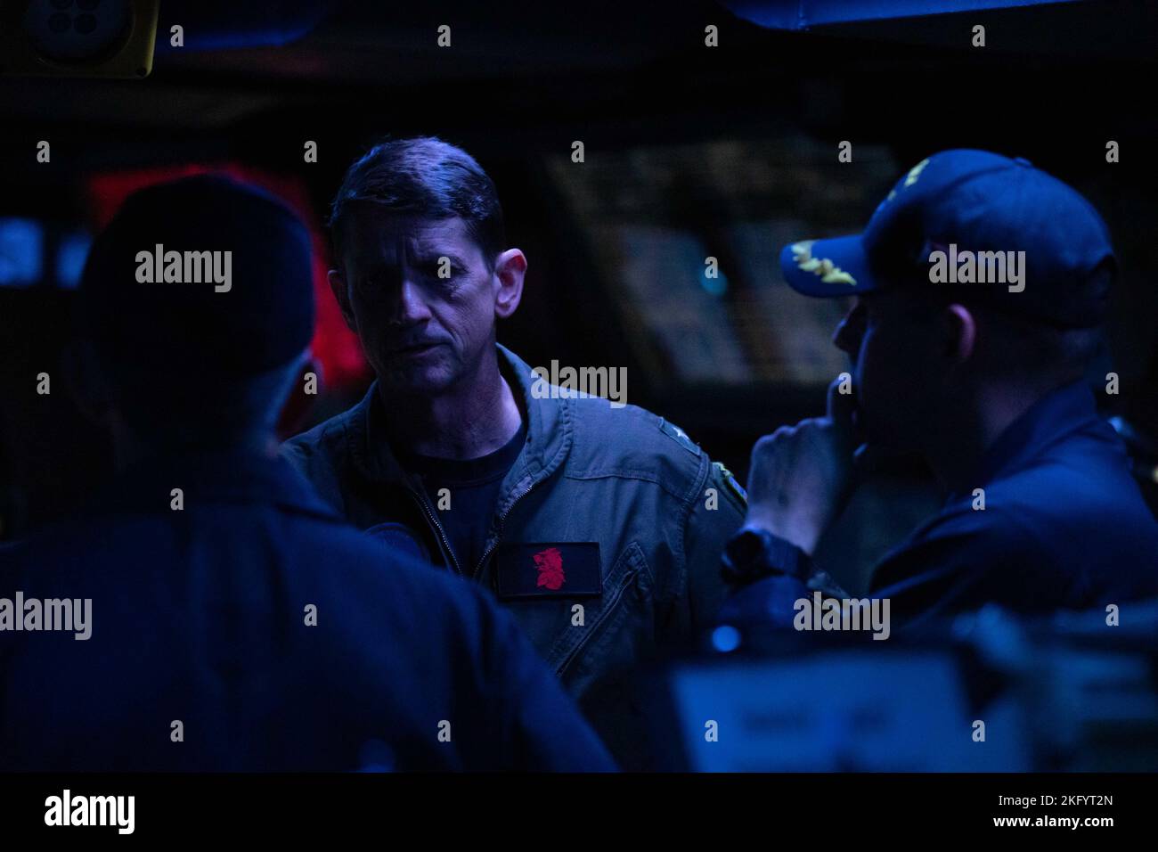 Rear Adm. Greg Huffman, center, Commander, Carrier Strike Group 12 ...