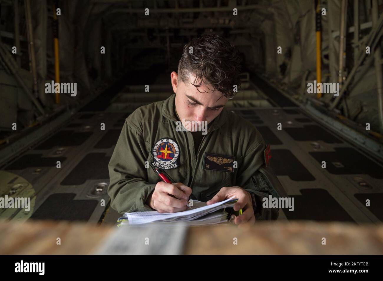 U.S. Marine Corps Cpl. Michael Elliott, a loadmaster with Marine Aerial ...